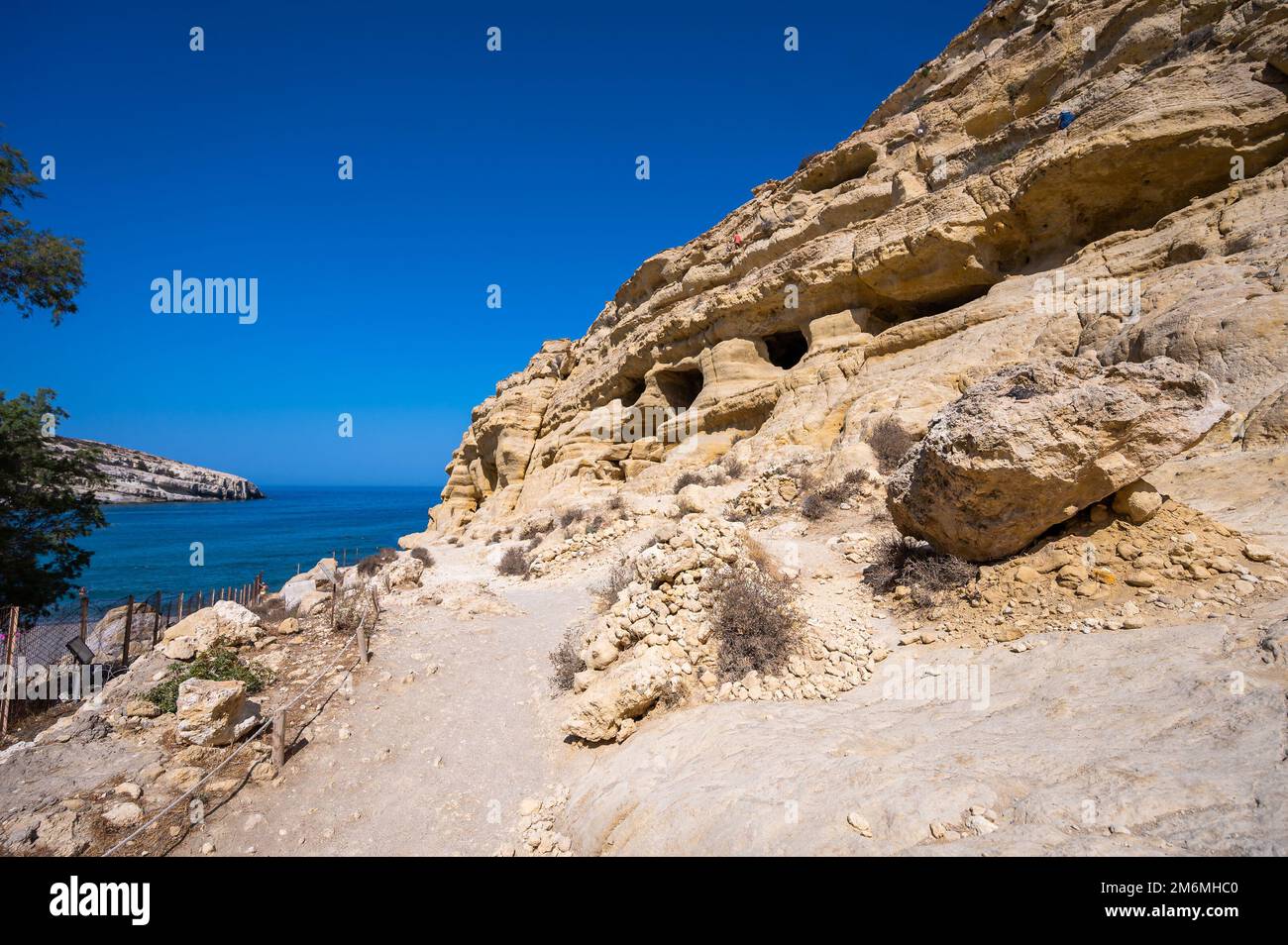Famous Matala beach with caves, known for hippies in the 70's. View of ...
