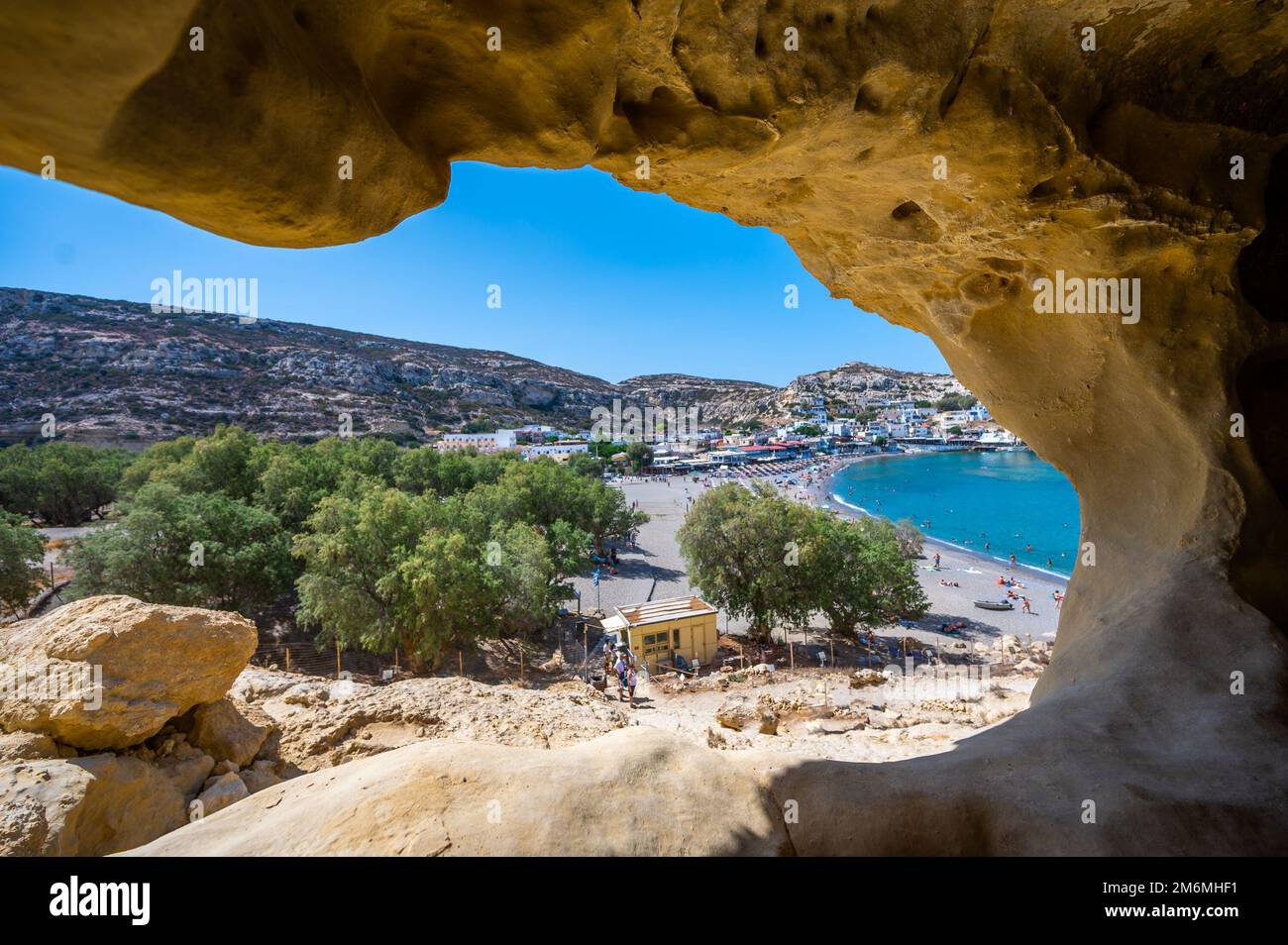 Famous Matala beach with caves, known for hippies in the 70's. View of ...
