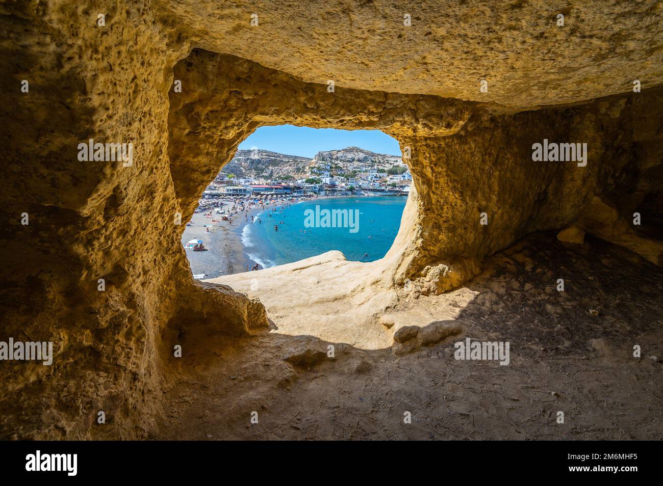 Famous Matala beach with caves, known for hippies in the 70's. View of ...