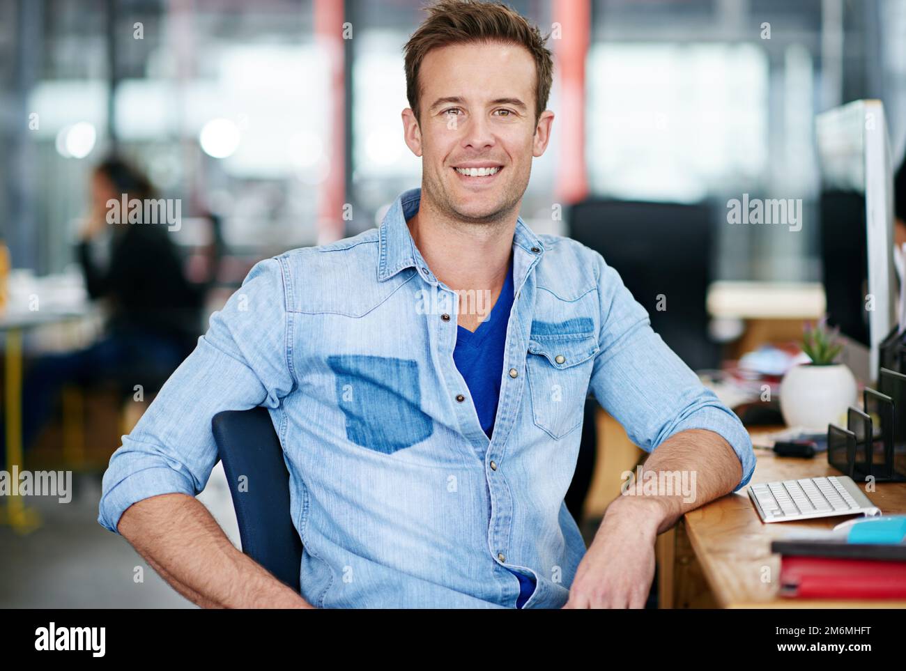 My space to create. Portrait of a handsome young man sitting at his ...