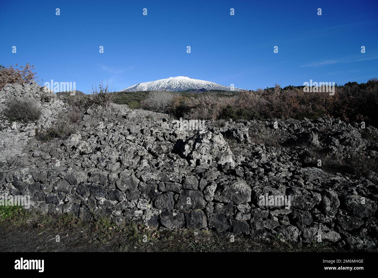 volcano rocks and winter Mount Etna in Sicily, Etna Park, Italy Stock ...