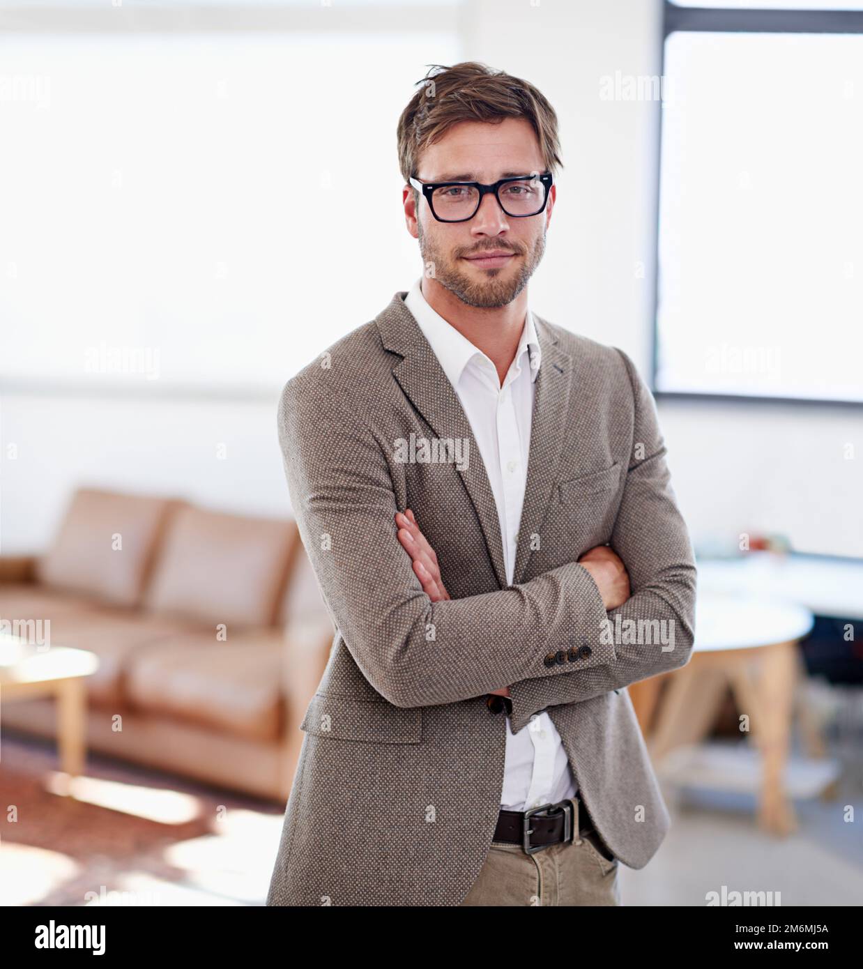 Hes the perfect office professional. Portrait of a young man standing ...