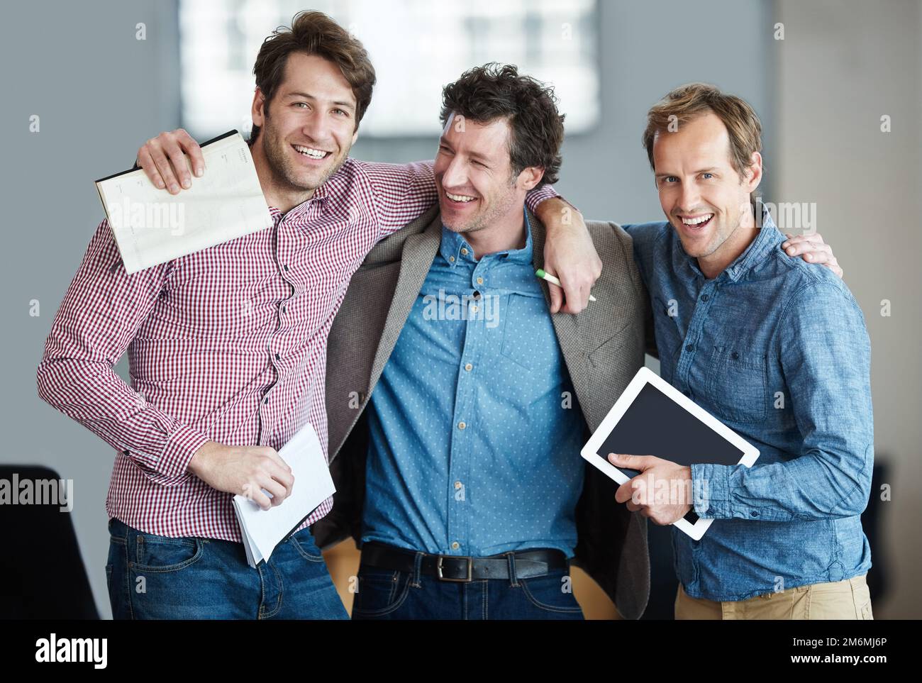 The boys are back in business. Portrait of a group of laughing ...