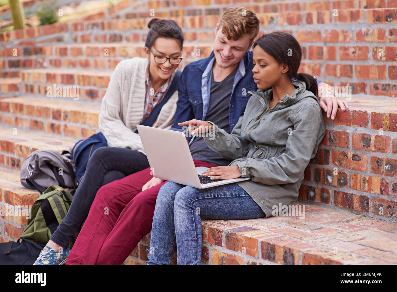 Theres always room for improvement. a group of students sitting outside ...