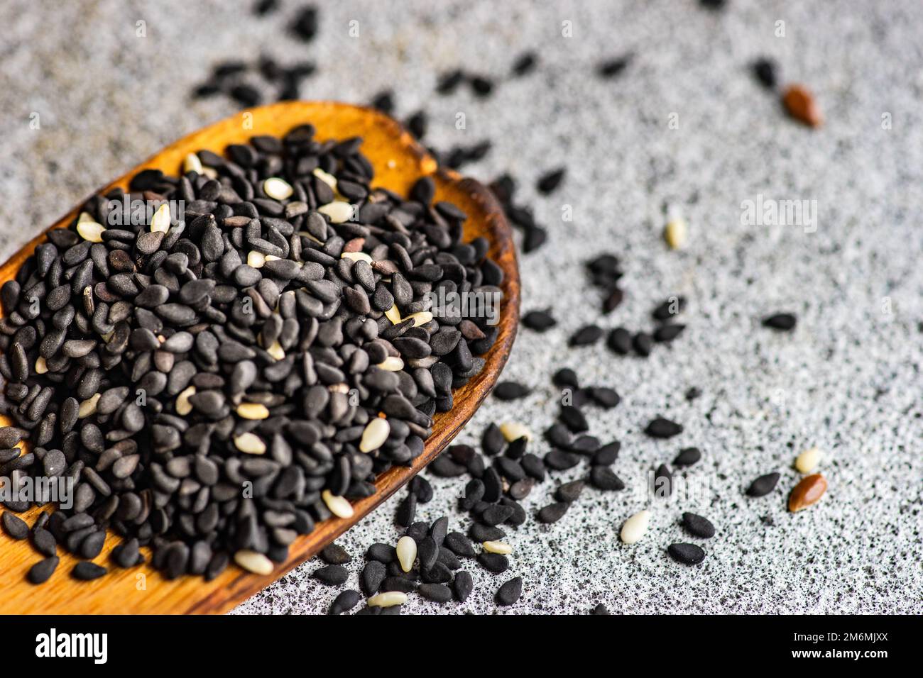 Spoon black sesame seeds hi-res stock photography and images - Alamy