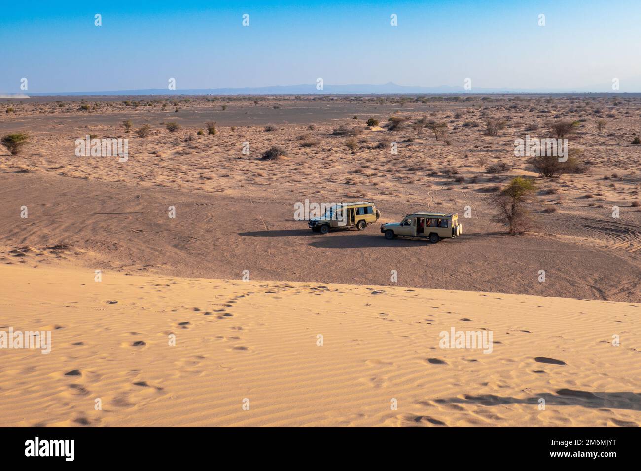 Tourist safari vehicles seen from North Horr Sand dunes in Marsabit ...