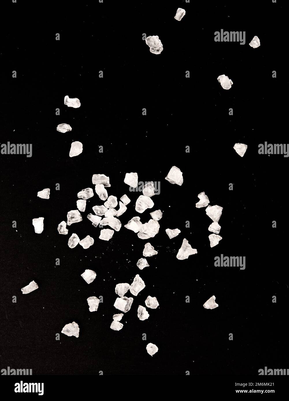 Salt on black Stock Photo - Alamy