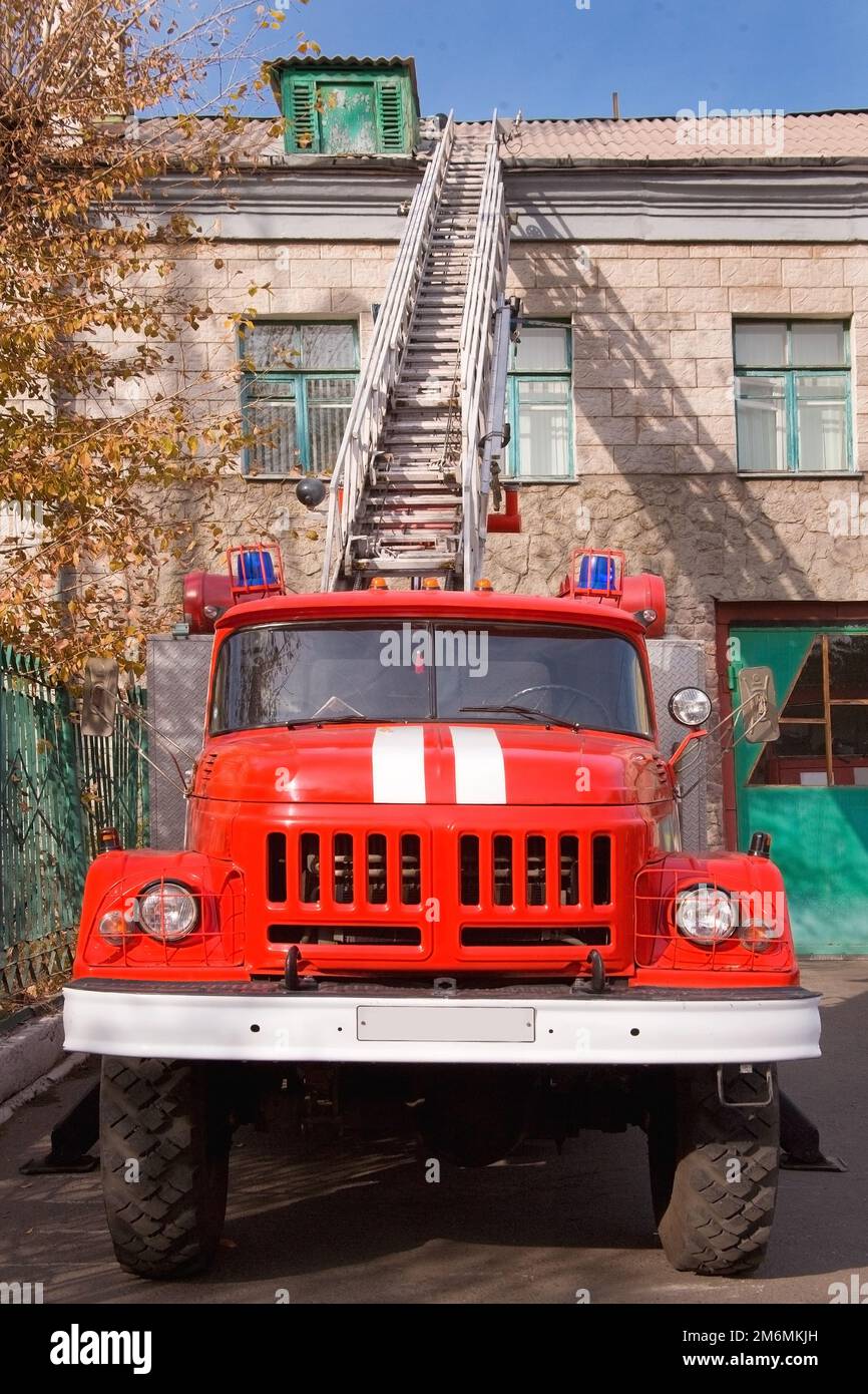 A large soviet red fire truck ZIL is preparing to leave Stock Photo - Alamy