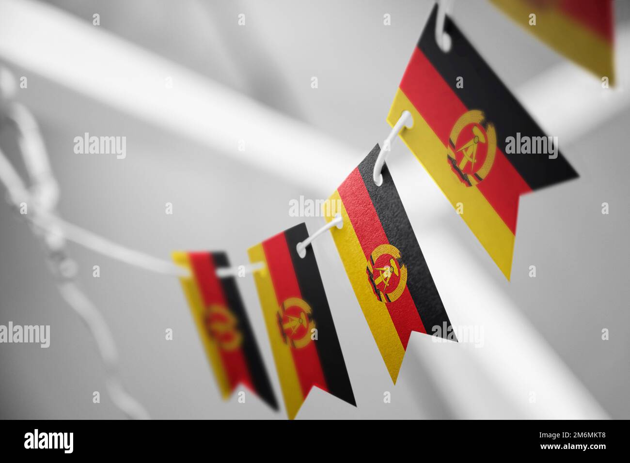 A garland of GDR national flags on an abstract blurred background Stock ...