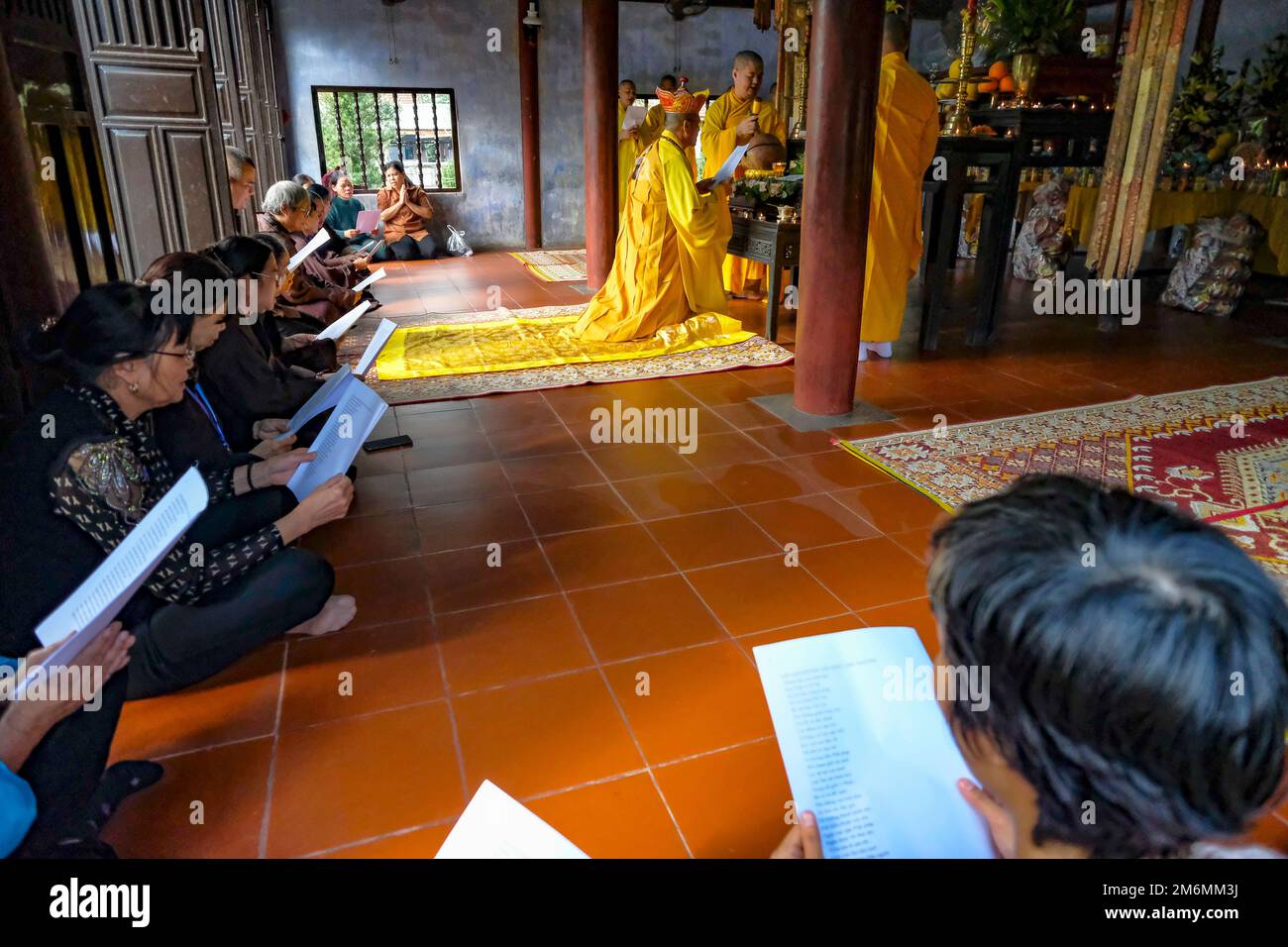 Hue, Vietnam - December 25, 2022: People praying at the Thien Mu Pagoda ...