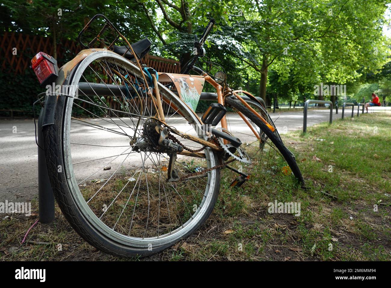 Scrap bike in people's garden Stock Photo - Alamy