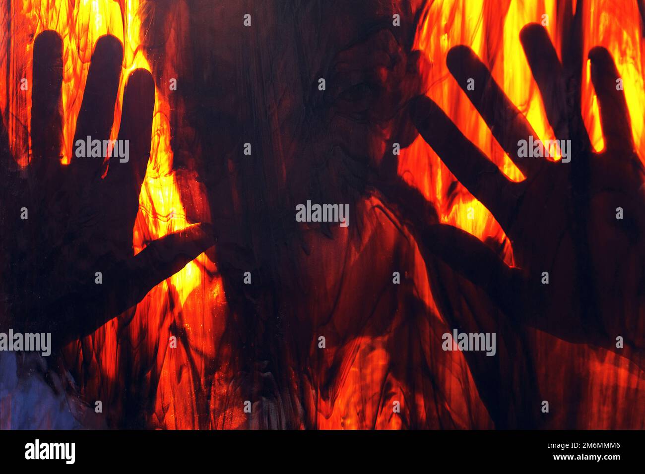 Man scary silhouette through surreal abstract pattern of stained glass ...