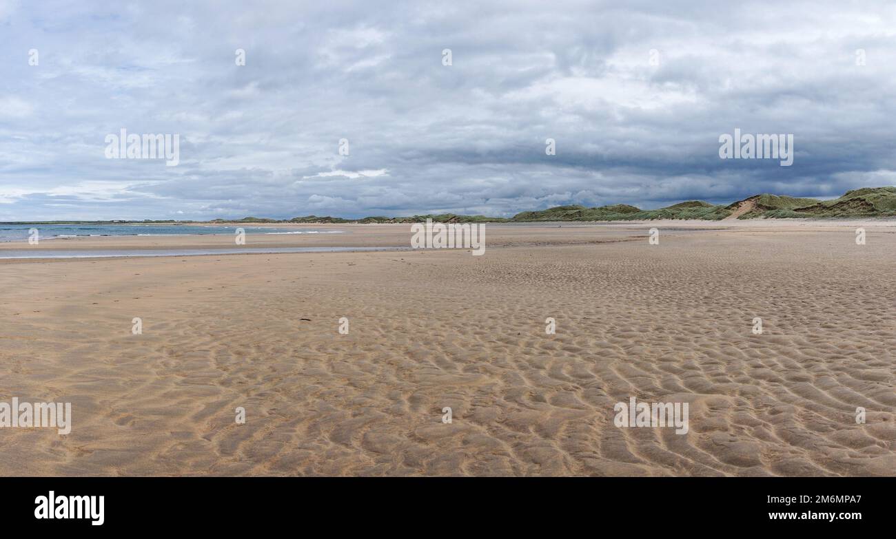 Panorama landscape of Doughmore Beach in County Clare at low tide with ...
