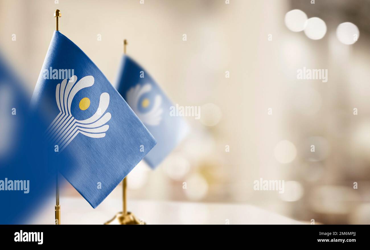 Small flags of the CIS on an abstract blurry background Stock Photo - Alamy