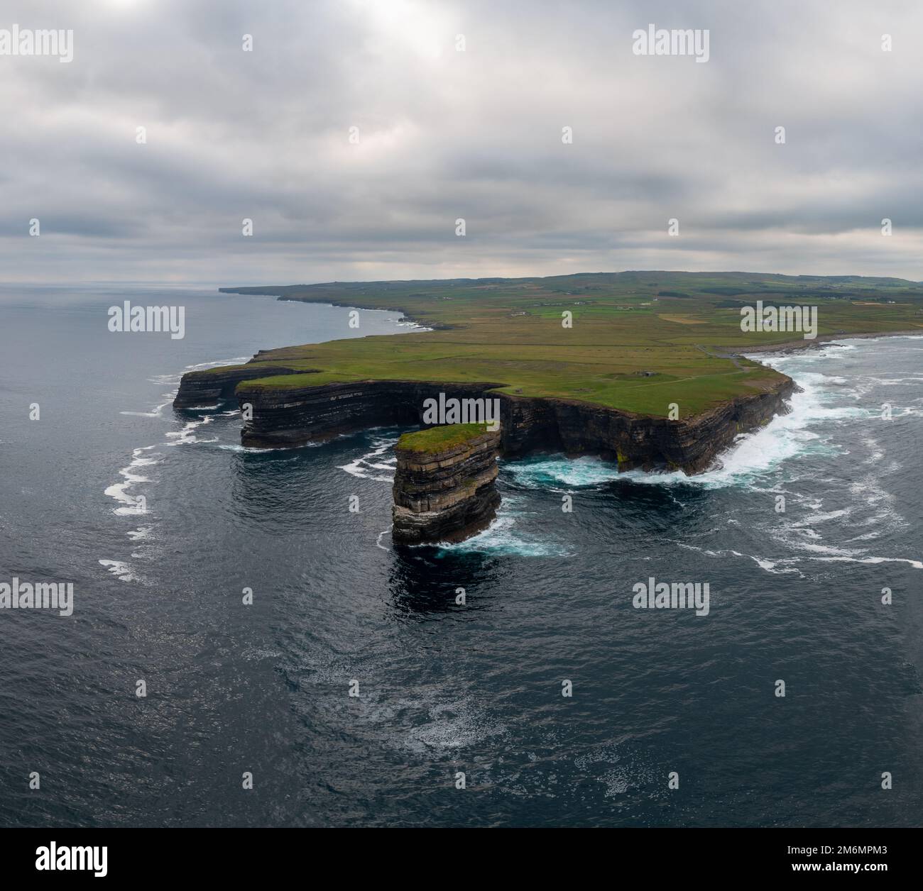 Drone view of the Downpatrick Head sea stack and cliffs and coastline ...
