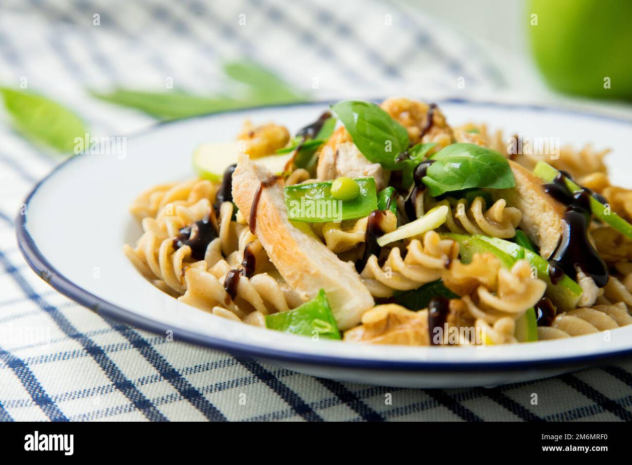 Pasta salad with apple, basil, parmesan and chicken Stock Photo - Alamy