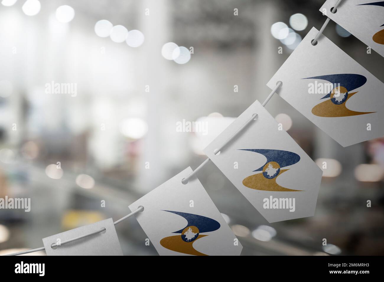 A garland of Eurasian Economic Union national flags on an abstract ...