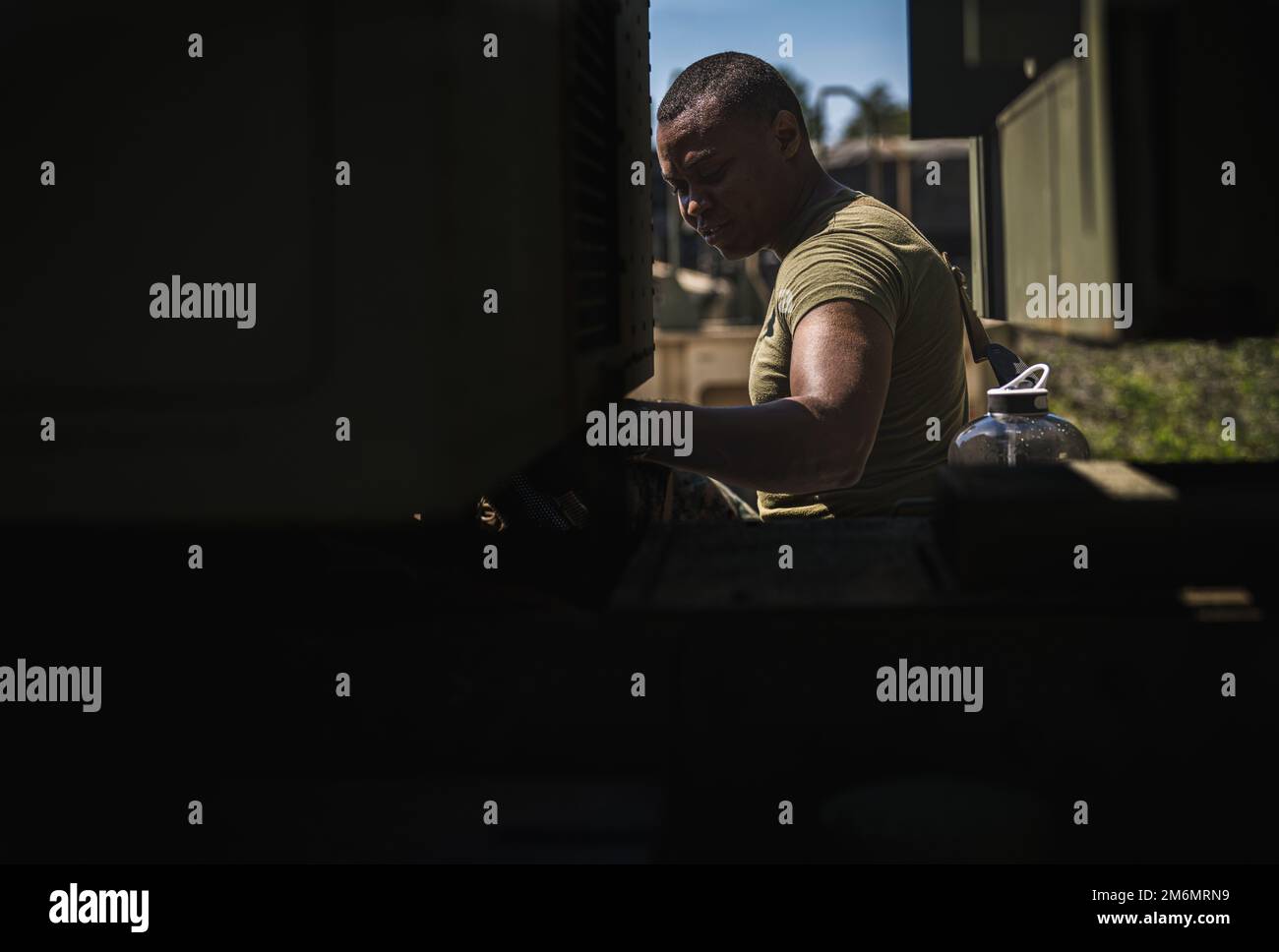 A U.S. Marine Corps crewman with Kilo Battery, 2nd Battalion, 14th ...