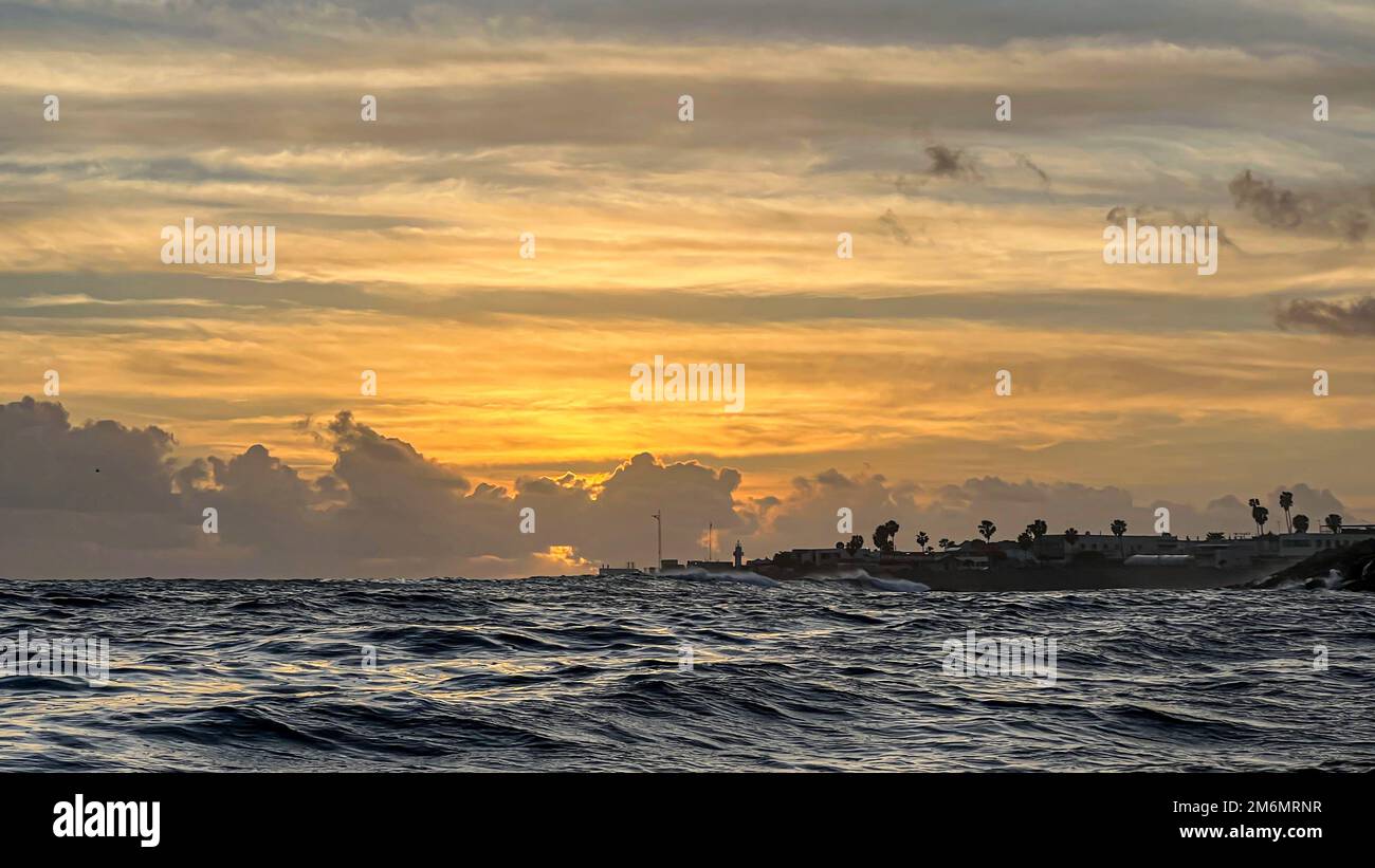 Hazy sunset over pacific ocean in Ensenada Mexico Stock Photo - Alamy