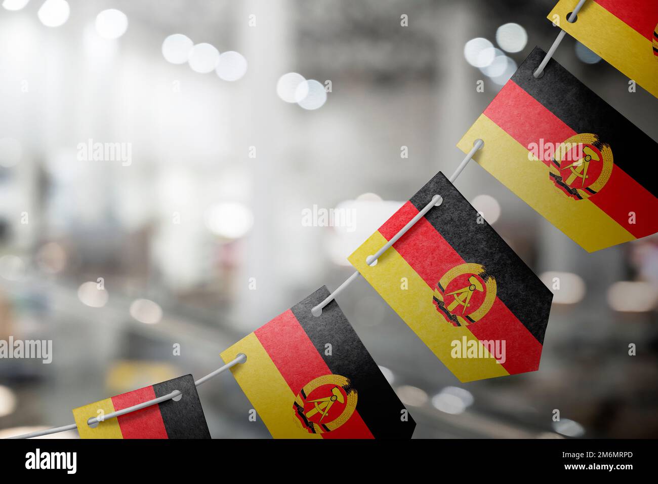 A garland of GDR national flags on an abstract blurred background Stock ...
