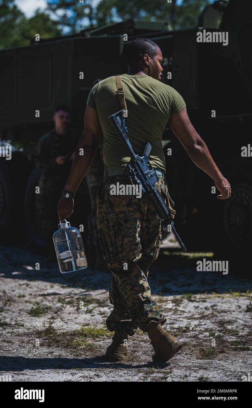 A U.S. Marine Corps crewman with Kilo Battery, 2nd Battalion, 14th ...