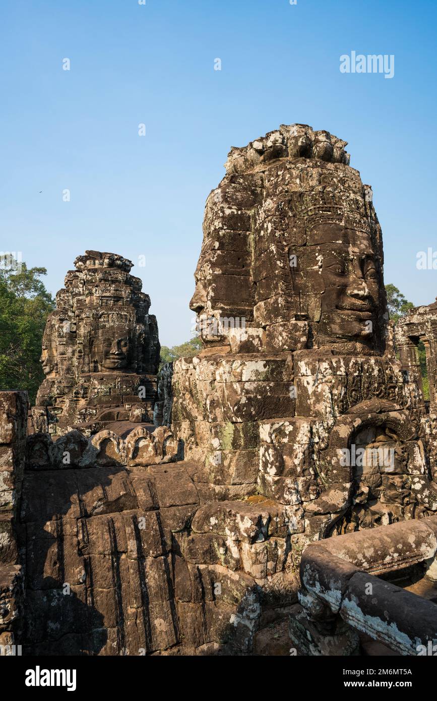 Angkor bayon giant statues Stock Photo - Alamy