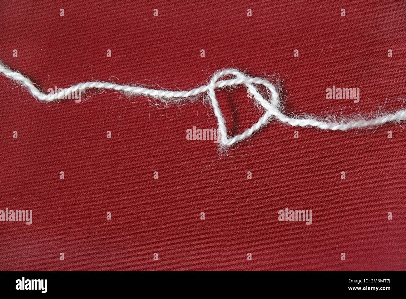 Woolen Yarn in Heart Shape with Copy Space Stock Photo - Alamy