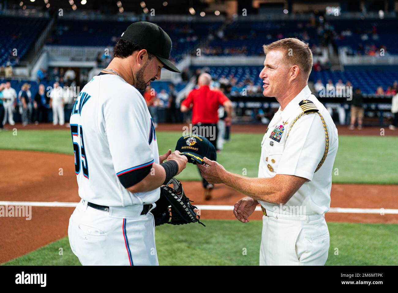 MIAMI, Fla. (May 2, 2022) - U.S. Navy Capt. Greg Smith (right), chief of staff, Navy Region ...