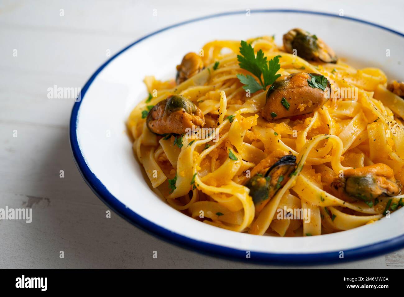 Tagliatelle Pasta frutti di mare. Fresh pasta with mussels and ...