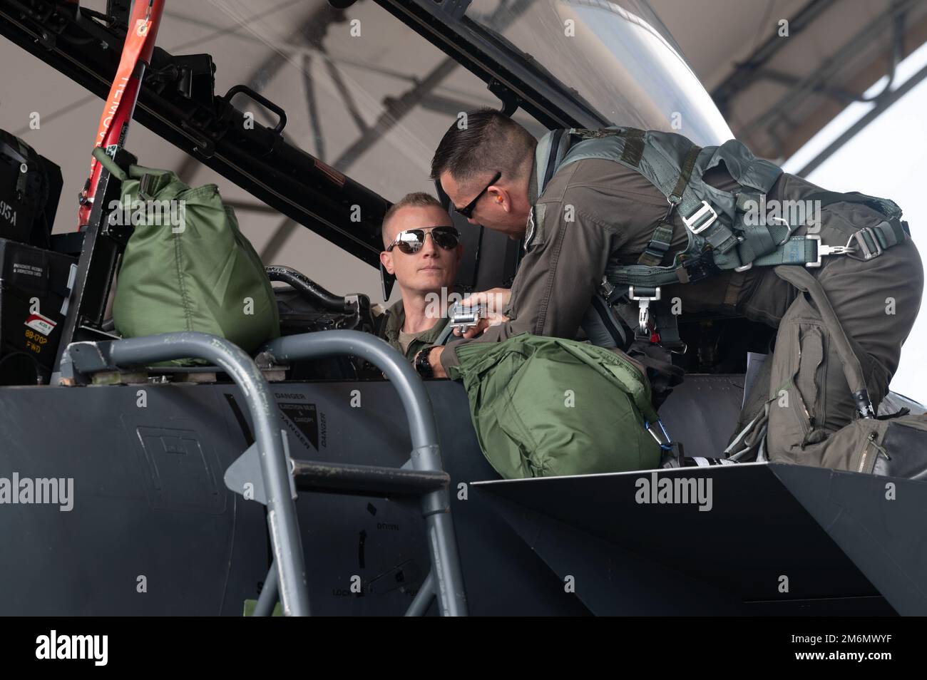 Col. Kurt Helphinstine, 4th Fighter Wing commander, helps SrA Garret ...