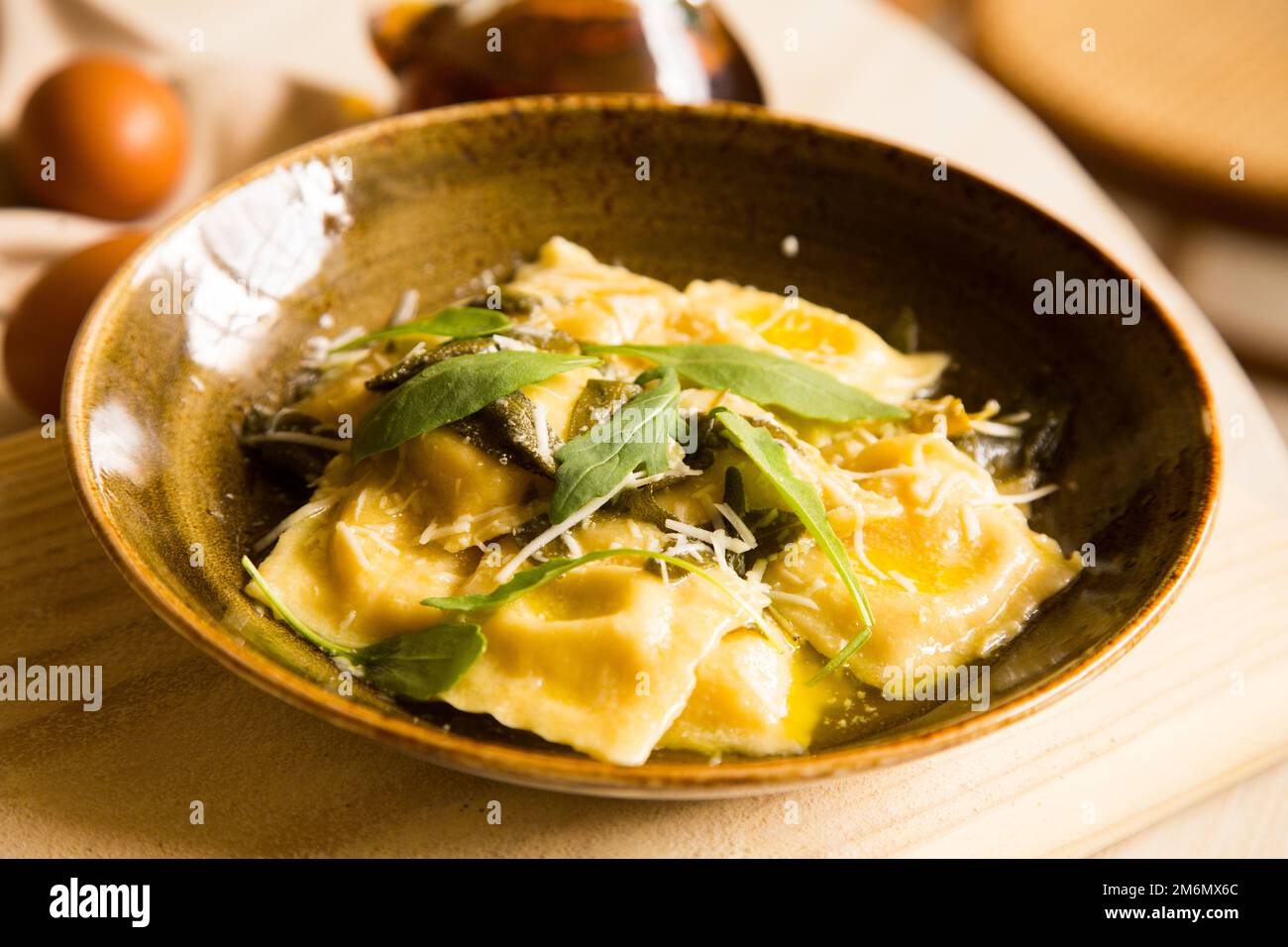 Stuffed ravioli pasta cooked with cheese sauce. Traditional Italian ...