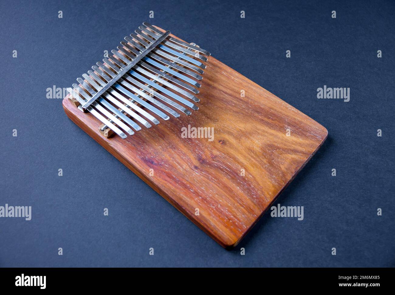 Traditional wooden kalimba isolated on black Stock Photo - Alamy