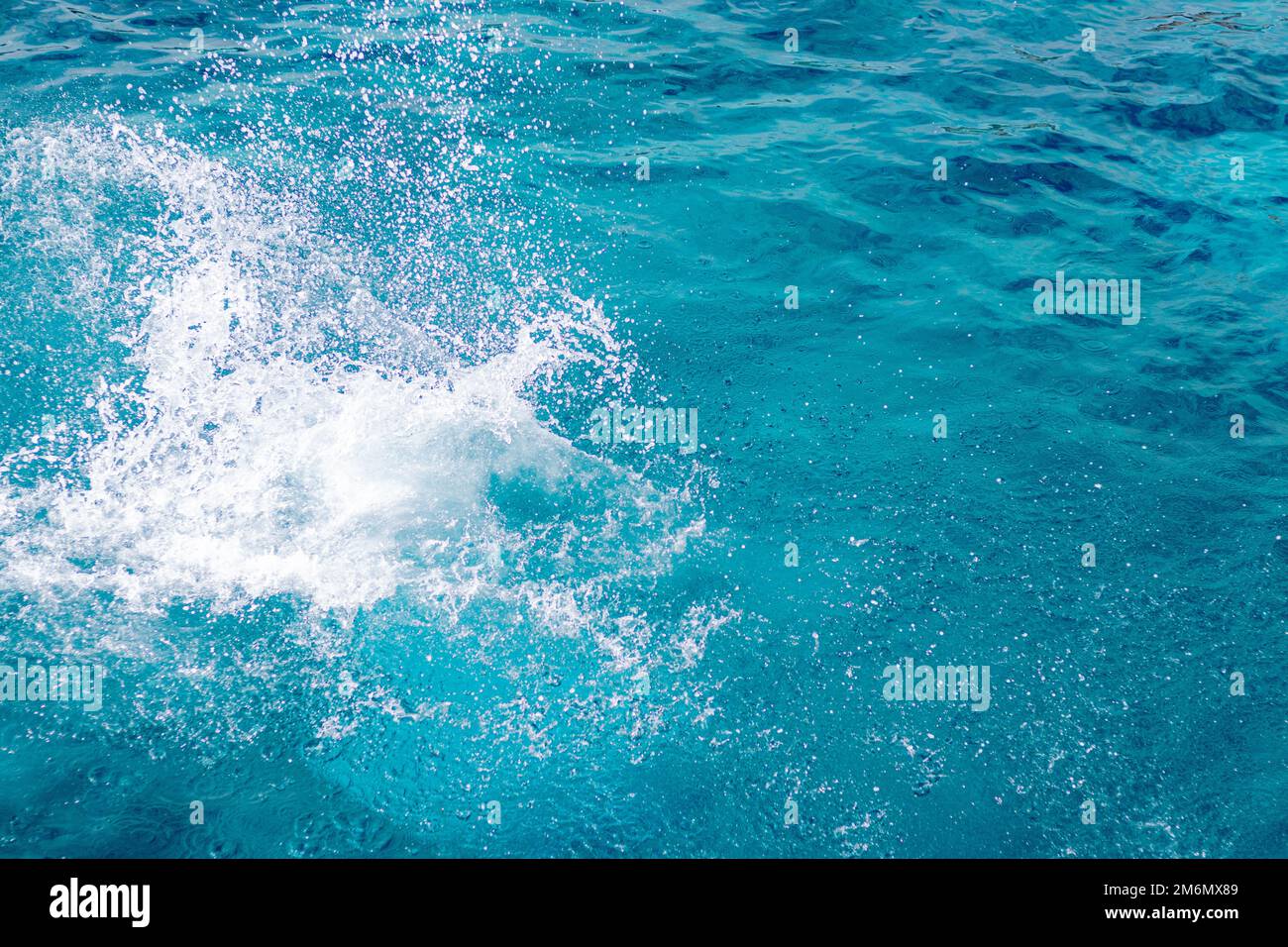 Splashes of blue, sea water with foam bubbles. A splash of nature on a ...