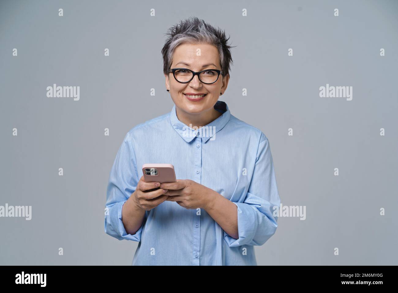 Typing woman in grey hi-res stock photography and images - Alamy