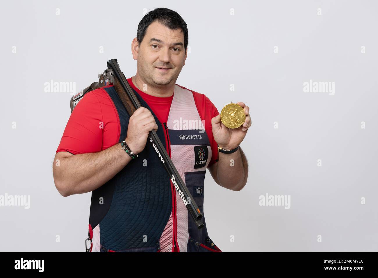 Czech trap shooter Jiri Liptak poses for photographer with gold medal ...