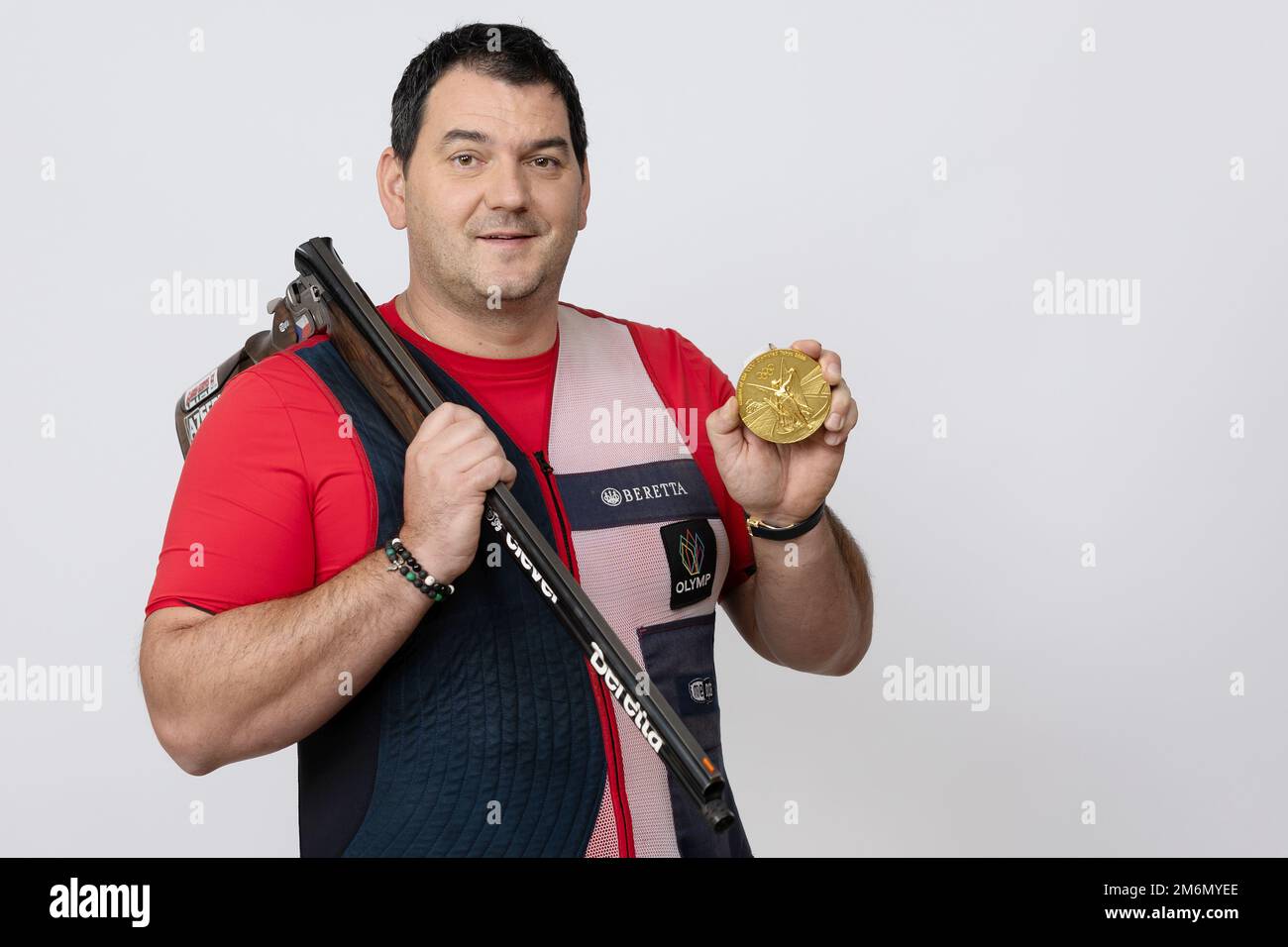 Czech trap shooter Jiri Liptak poses for photographer with gold medal ...