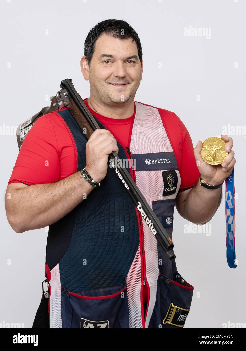 Czech trap shooter Jiri Liptak poses for photographer with gold medal ...