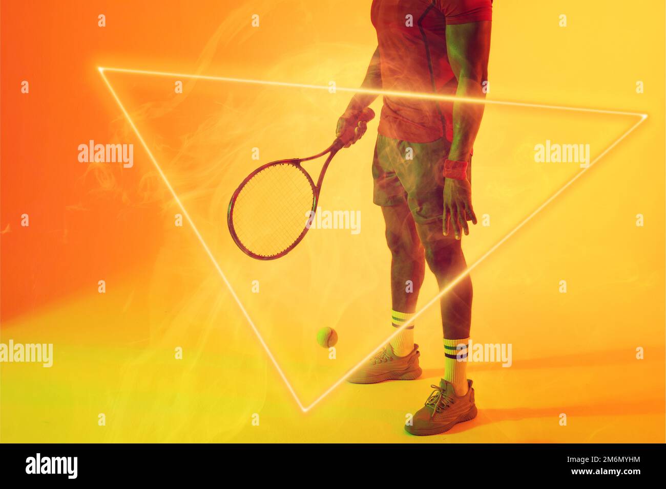 Low section of african american male tennis player with racket and ball ...