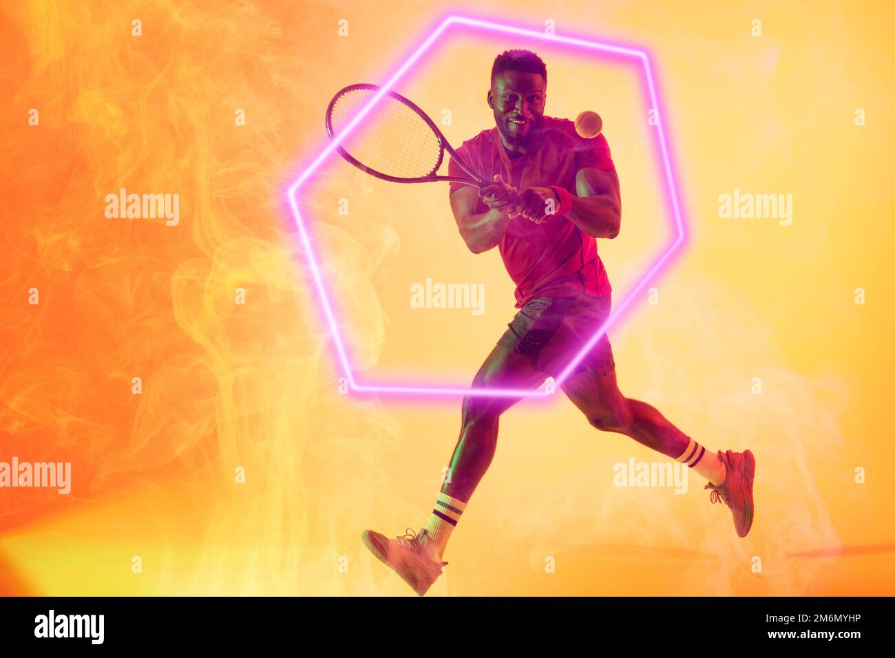 Illuminated hexagon over african american male player playing tennis ...