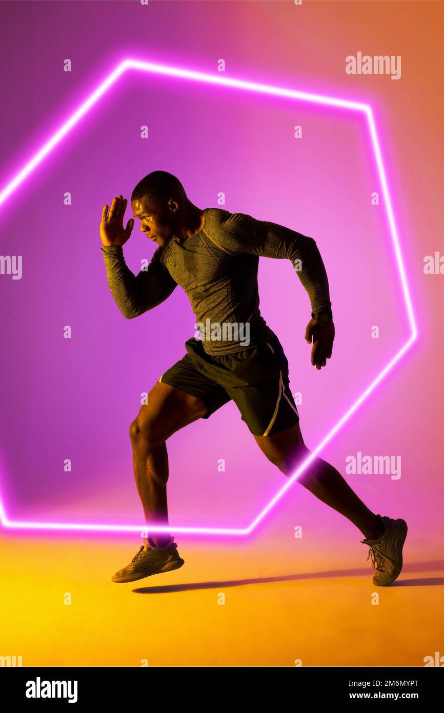 Illuminated hexagon and african american male athlete running over ...