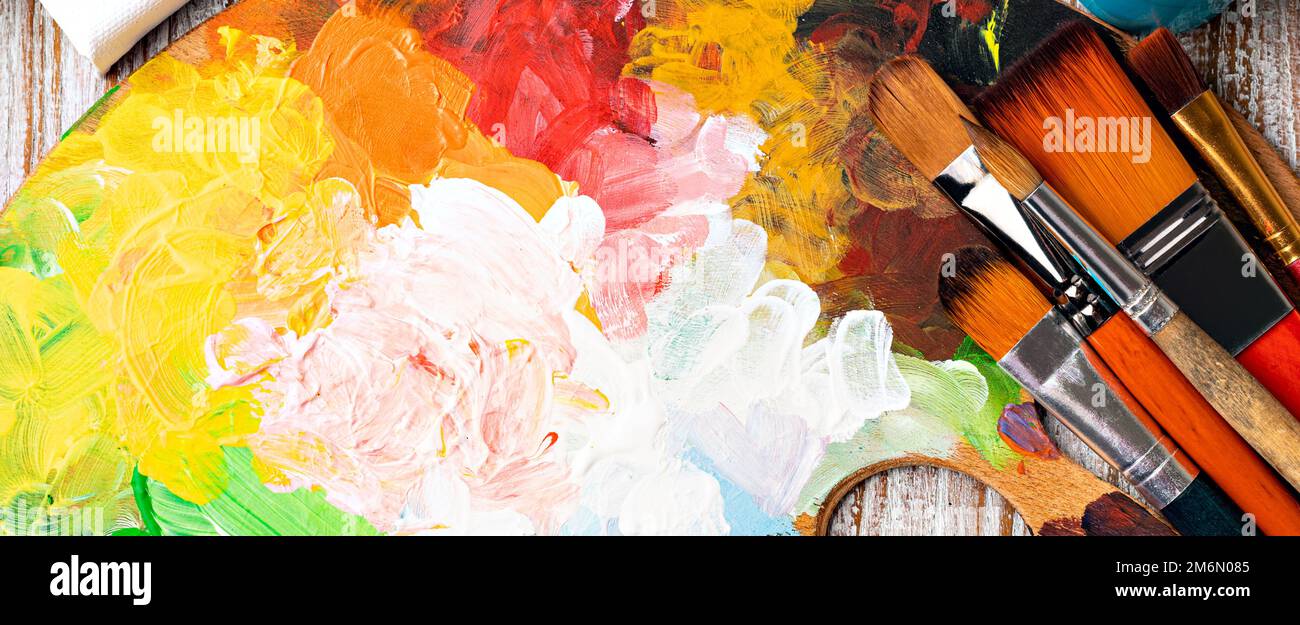 Art palette with colorful mixed paints Stock Photo - Alamy