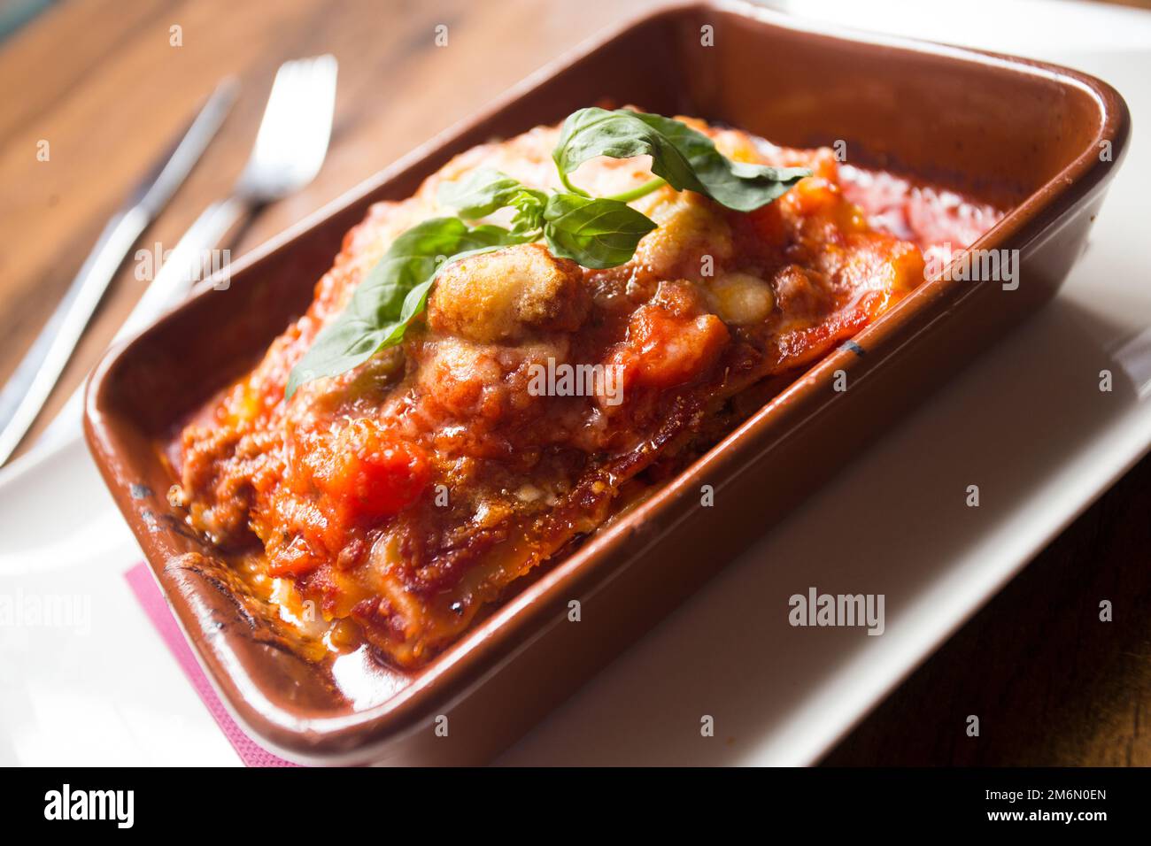 Lasagna with meat and tomato. Lasagna is a type of pasta. It is usually ...