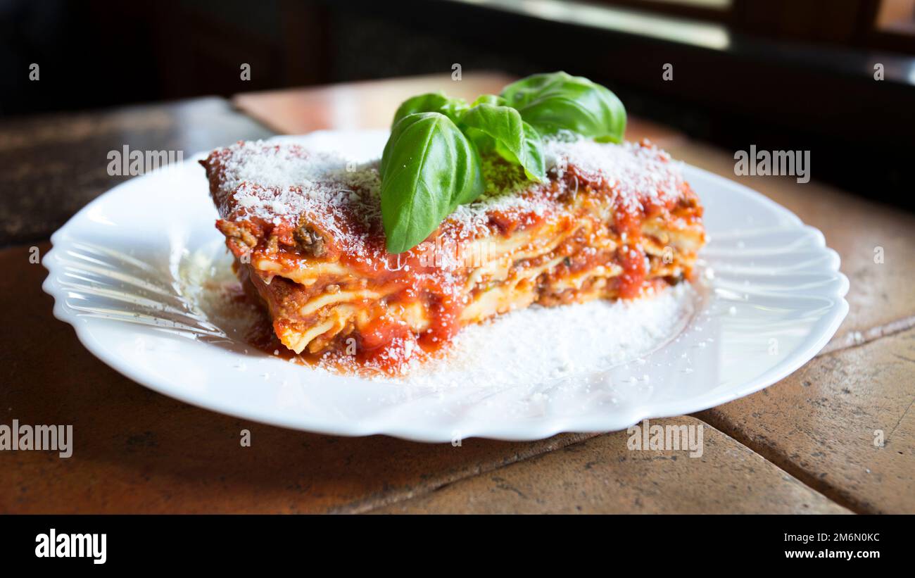 Lasagna with meat and tomato. Lasagna is a type of pasta. It is usually ...
