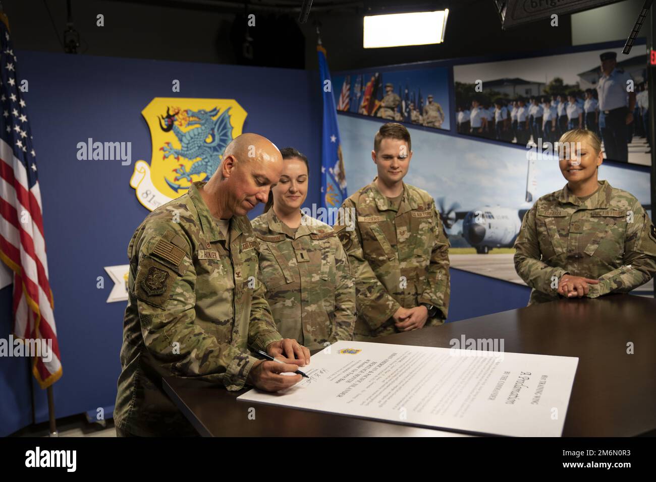 U.S. Air Force Col. William Hunter, 81st Training Wing commander, signs ...