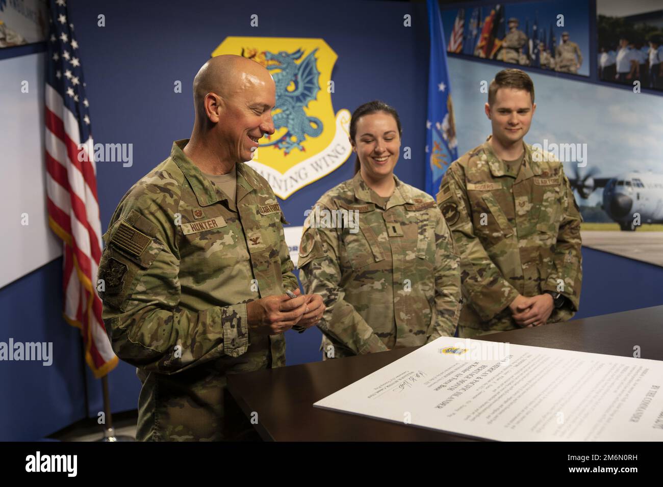 U.S. Air Force Col. William Hunter, 81st Training Wing commander, signs ...