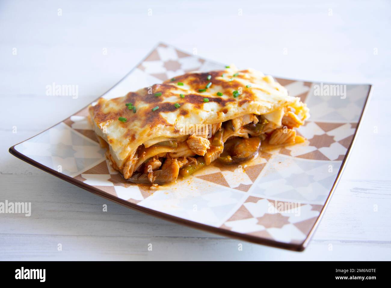 Chicken lasagna. Lasagna is a type of pasta. It is usually served in ...