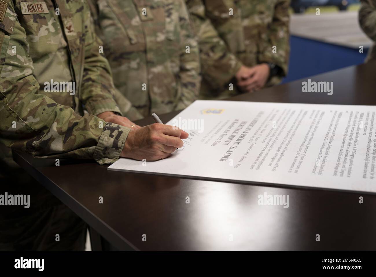 U.S. Air Force Col. William Hunter, 81st Training Wing commander, signs ...
