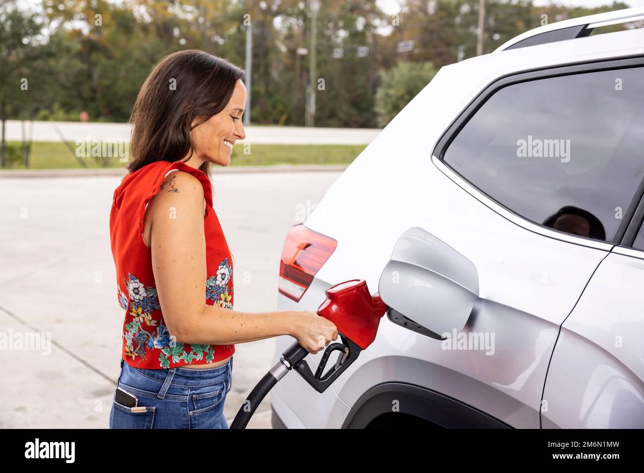 IMAGE DISTRIBUTED FOR EXXONMOBIL - A customer fills up their tank at an ...