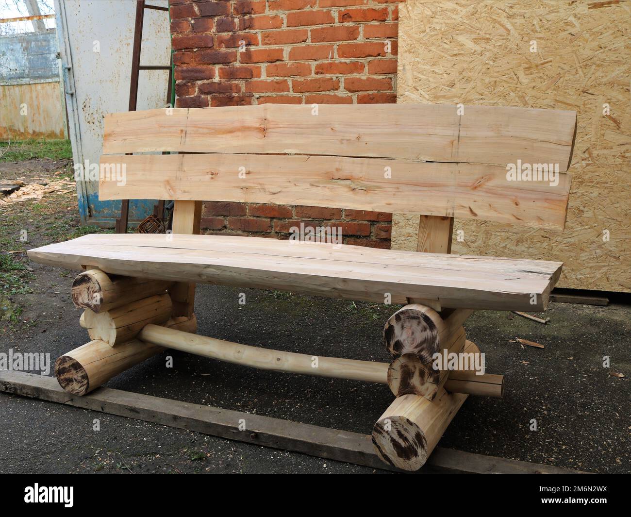 rustic freshly planed solid wood bench with beautiful texture standing ...