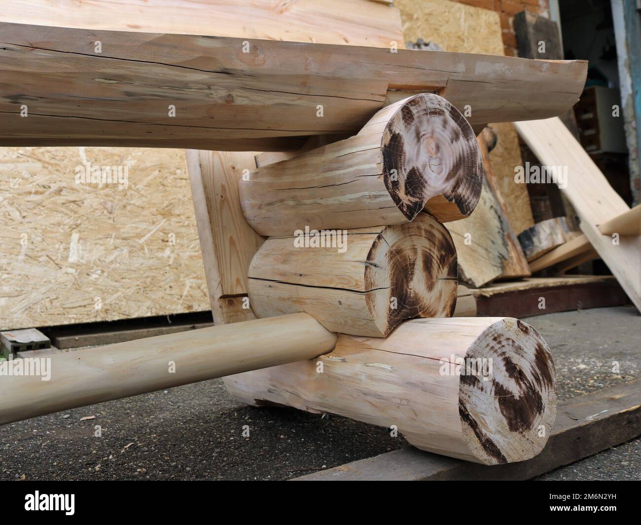 part of a log bench with burnt ends of logs, an element of the ...